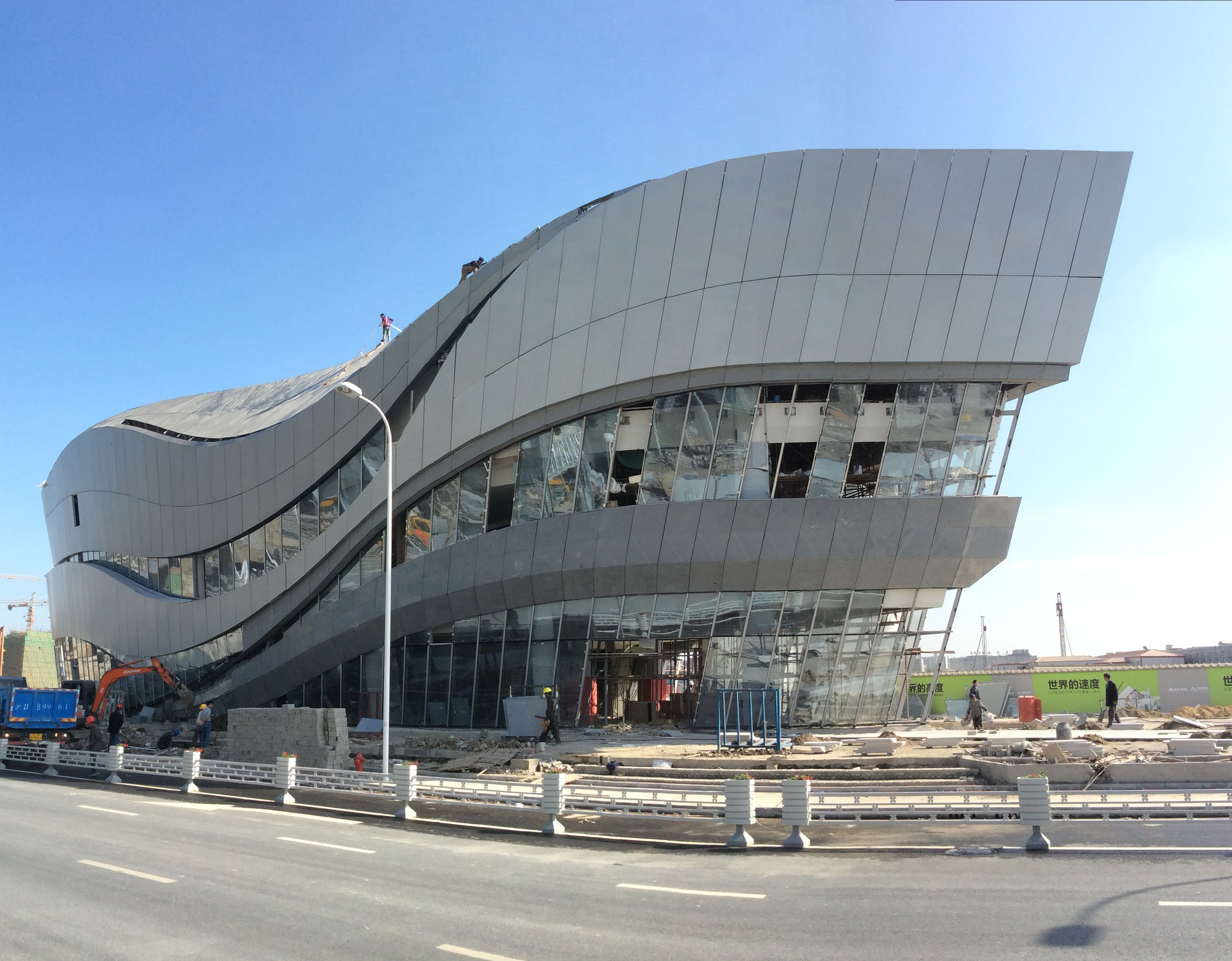 Gallery of Aedas' Leaf-Shaped Sales Gallery Nears Completion in ...