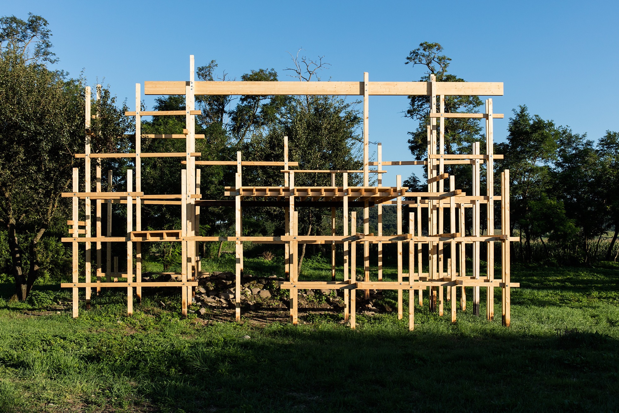 Gallery of Architects Construct Village of 14 Wooden Structures at ...