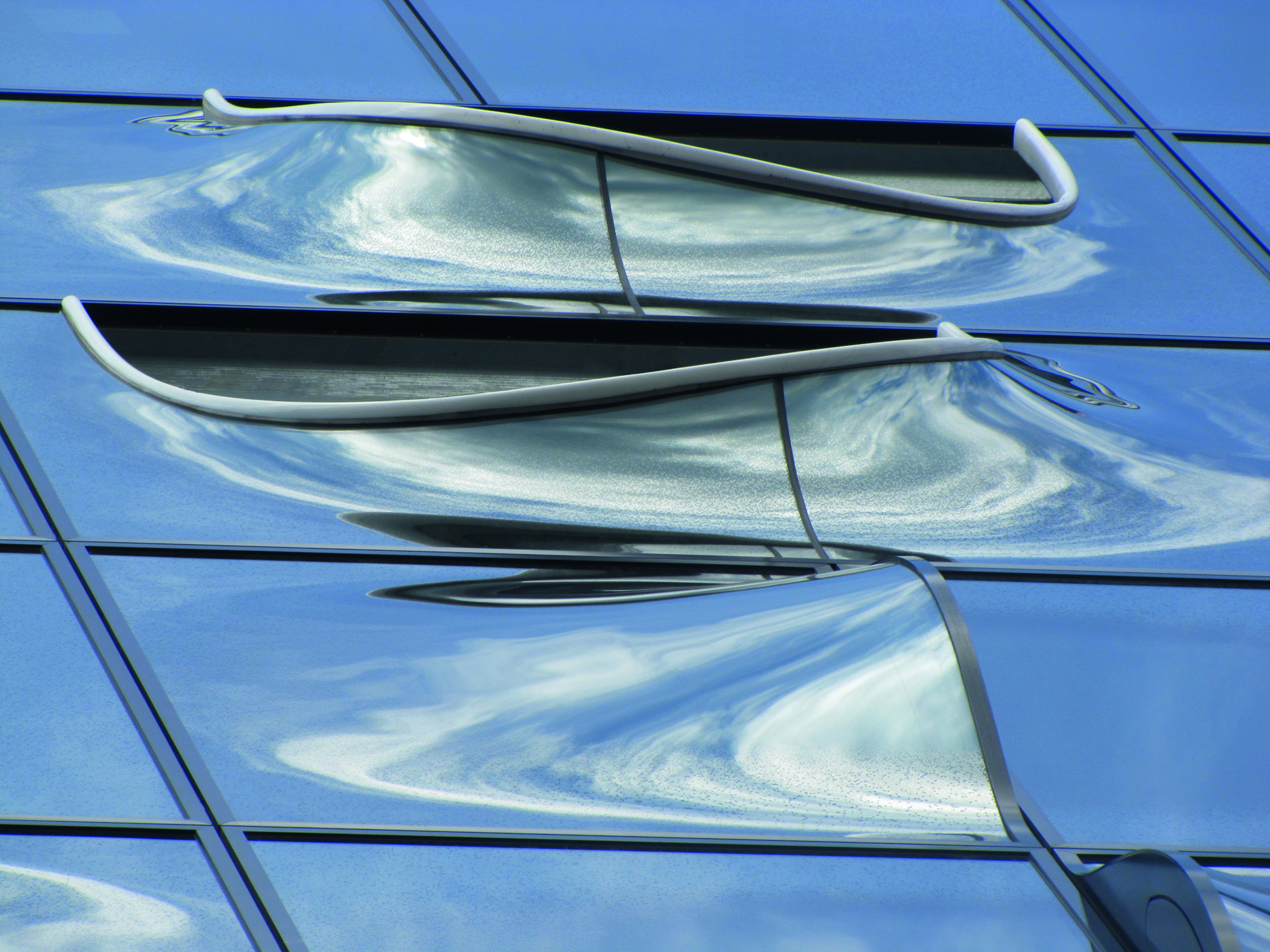 Gallery of Veiled in Brilliance: How Reflective Facades Have Changed ...