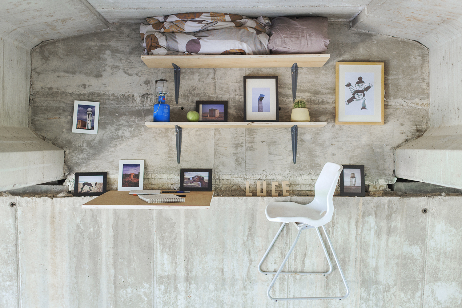 Gallery of Hidden Studio Beneath a Busy Bridge Provides Creative ...