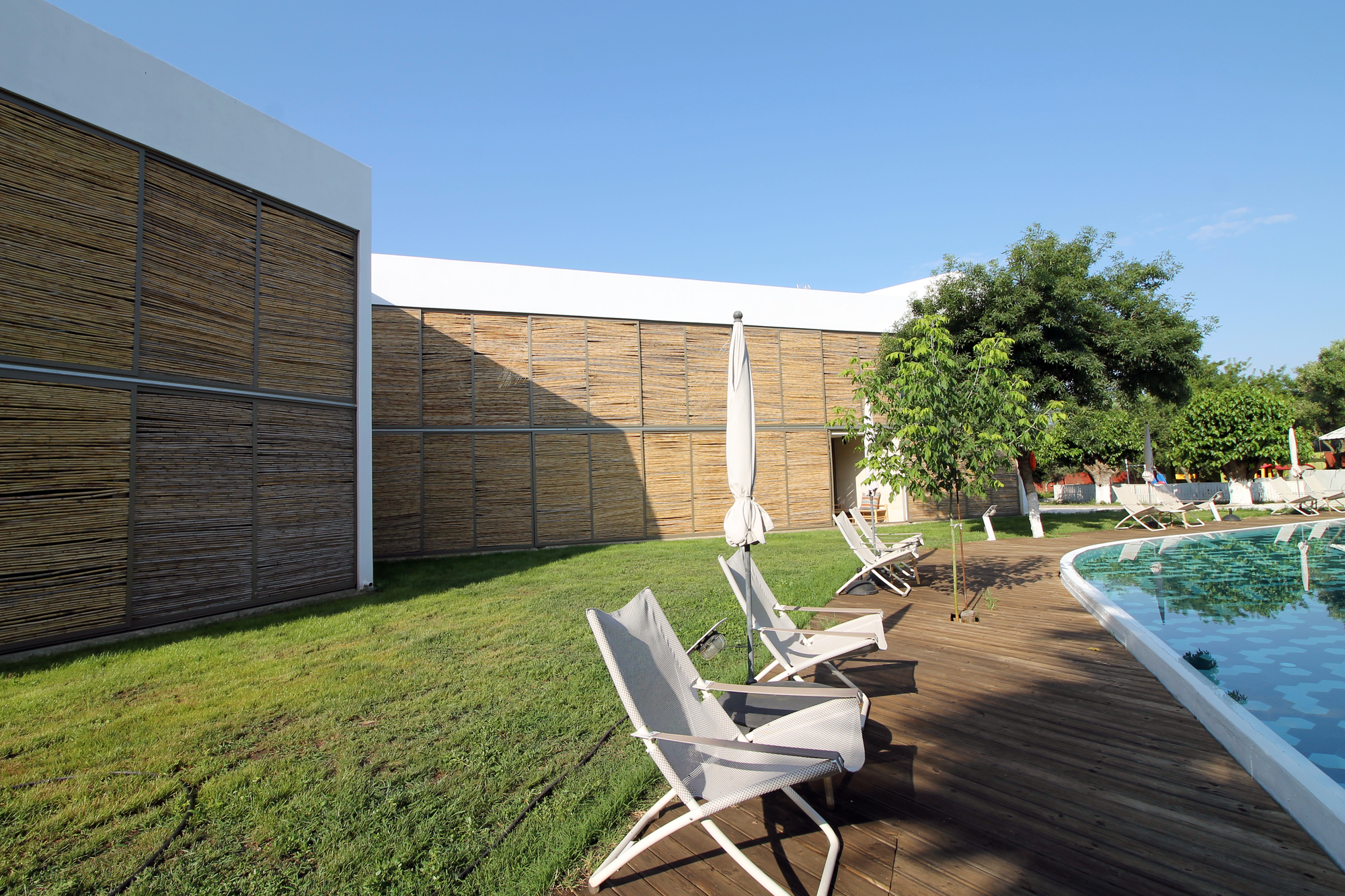 Gallery of ecoSuites, A Reed-Clad Hotel / Alex A. Tsolakis Architecture - 6