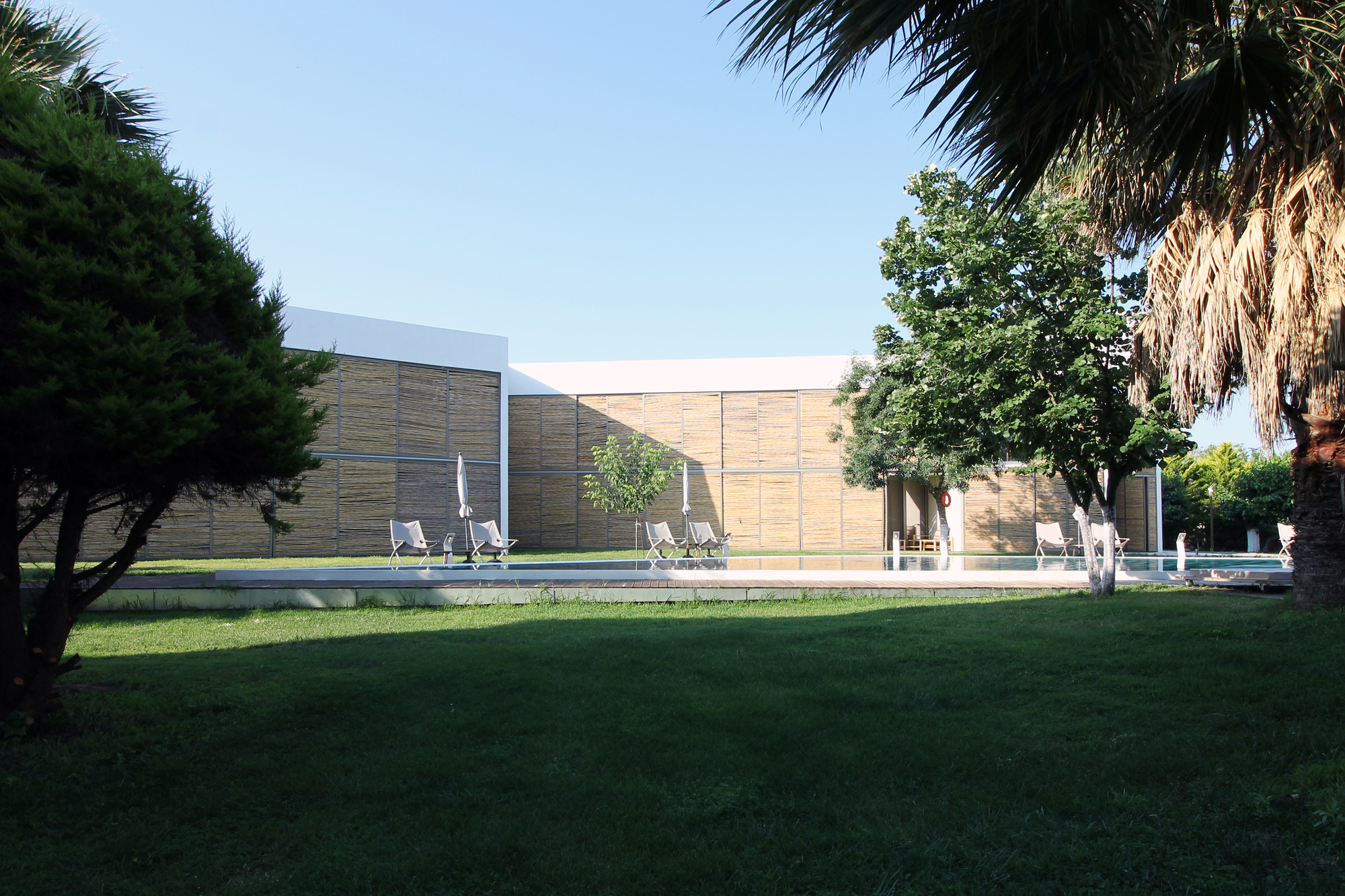 Gallery of ecoSuites, A Reed-Clad Hotel / Alex A. Tsolakis Architecture ...