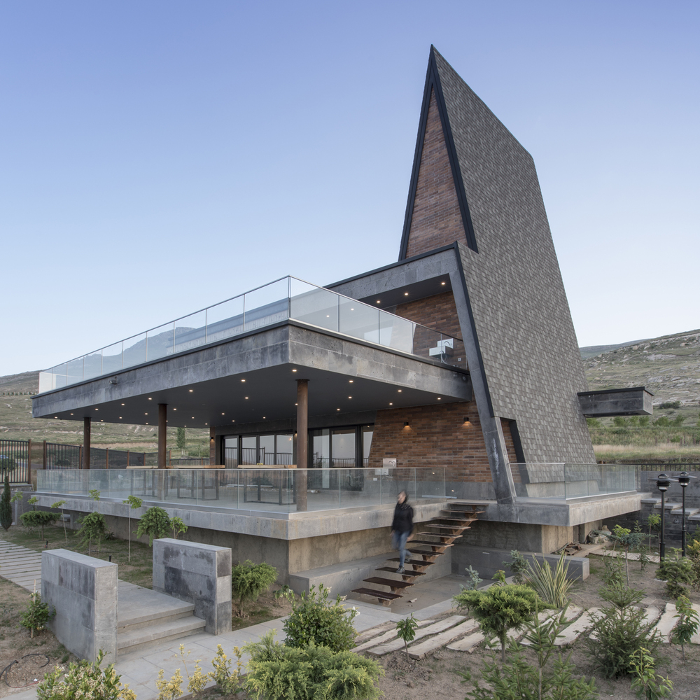 Gallery of 13 Houses with Pitched Roofs and their Sections - 9