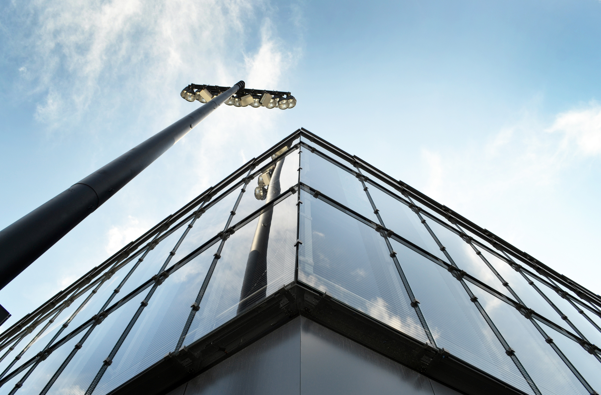 Gallery of How to Construct a Stadium Facade from Custom Glass While on ...