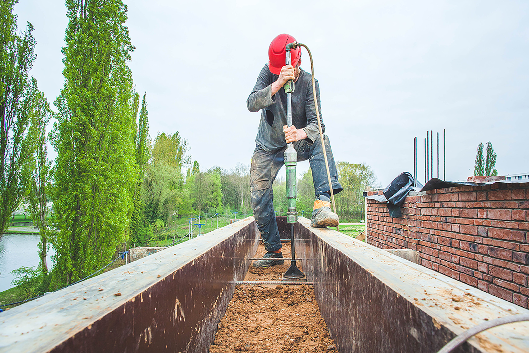 Gallery of Circular Brick House with Rammed Earth Wall / AST 77 ...