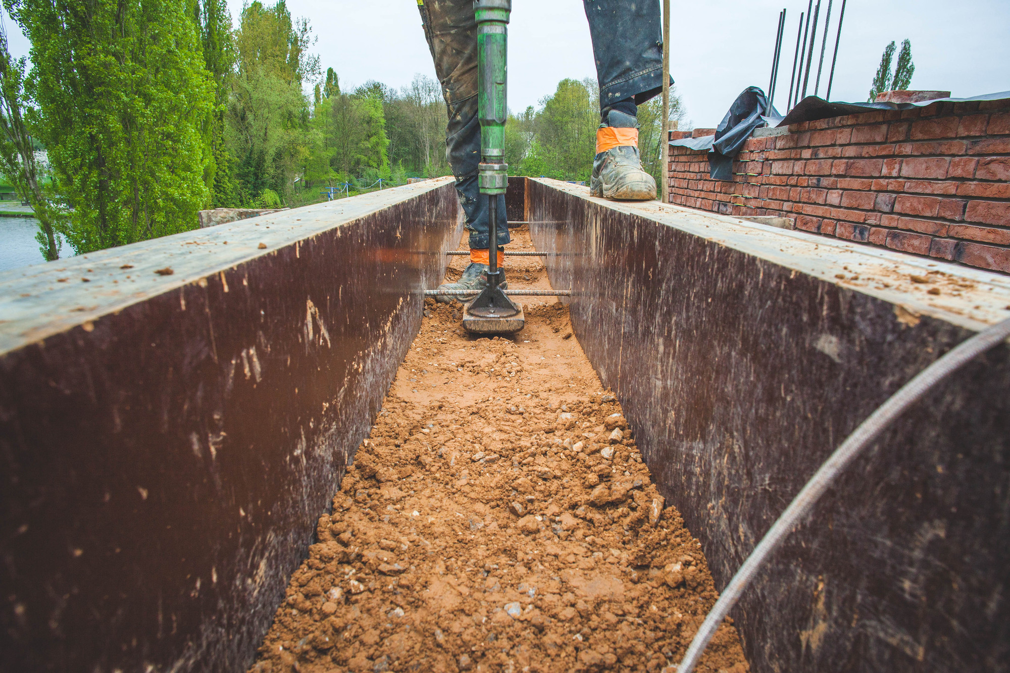 Gallery of Circular Brick House with Rammed Earth Wall / AST 77 ...