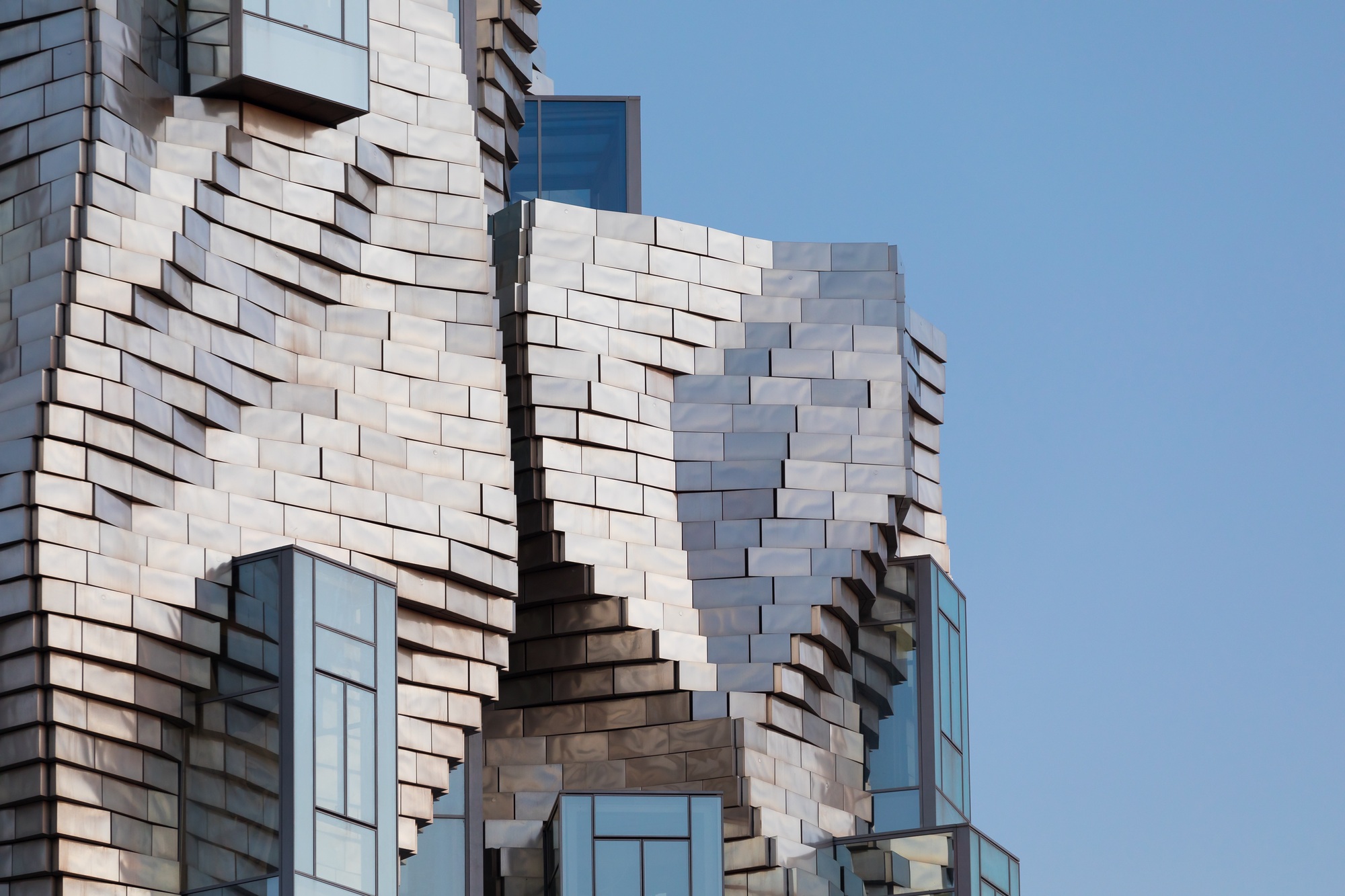 Gallery of Frank Gehry's Dynamic Reflective Tower Opens to the Public ...