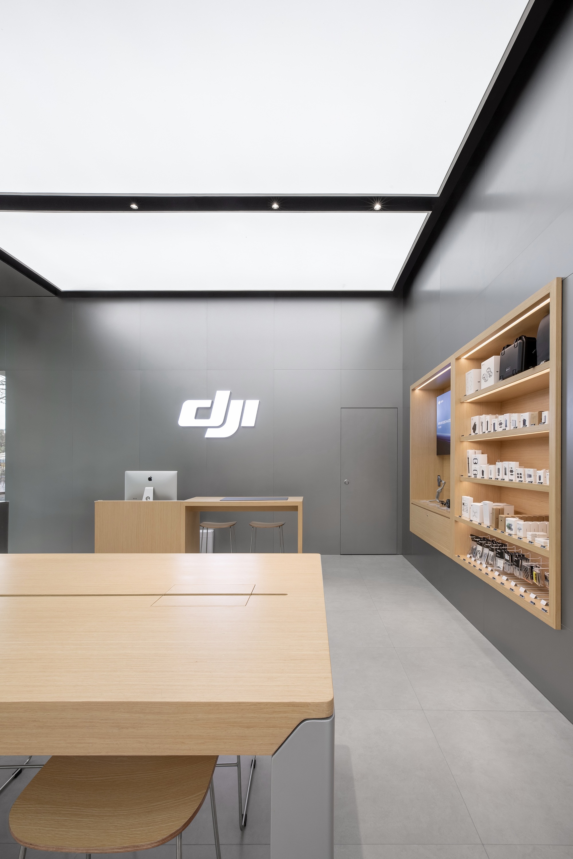 Gallery of DJI Retail Store / E Studio - 19