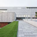 Refinement and Warmth: Incorporating Wood into a School’s Façade ...