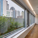 T Roof Commercial and Residential Building / SOSU Architects | ArchDaily