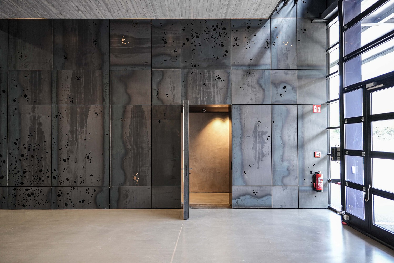 Gallery of Opening Up / Industry Meets Design: Steel Pivot Doors in a ...