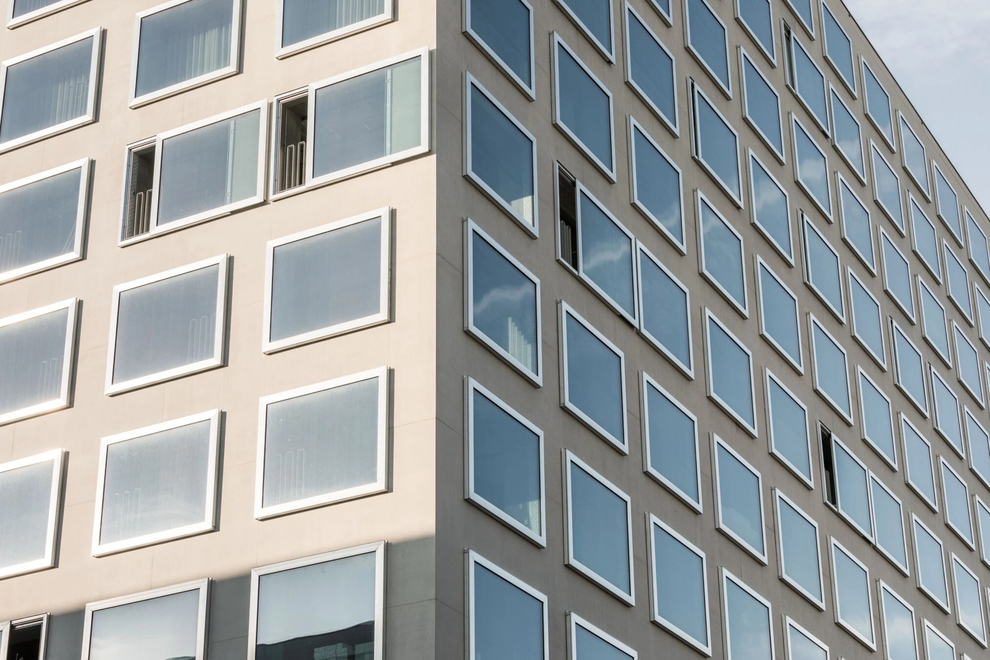 Gallery of The Crucial Role of Glass Facades in Four Housing Projects - 13