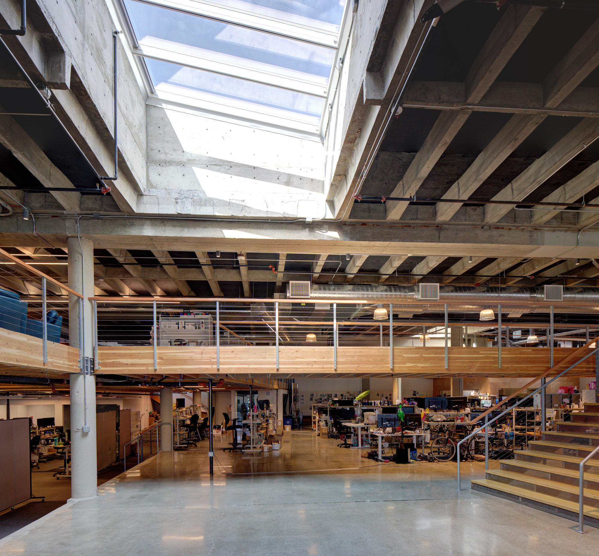 Gallery of Maximizing Space with Mezzanine Levels in Offices and Homes - 8