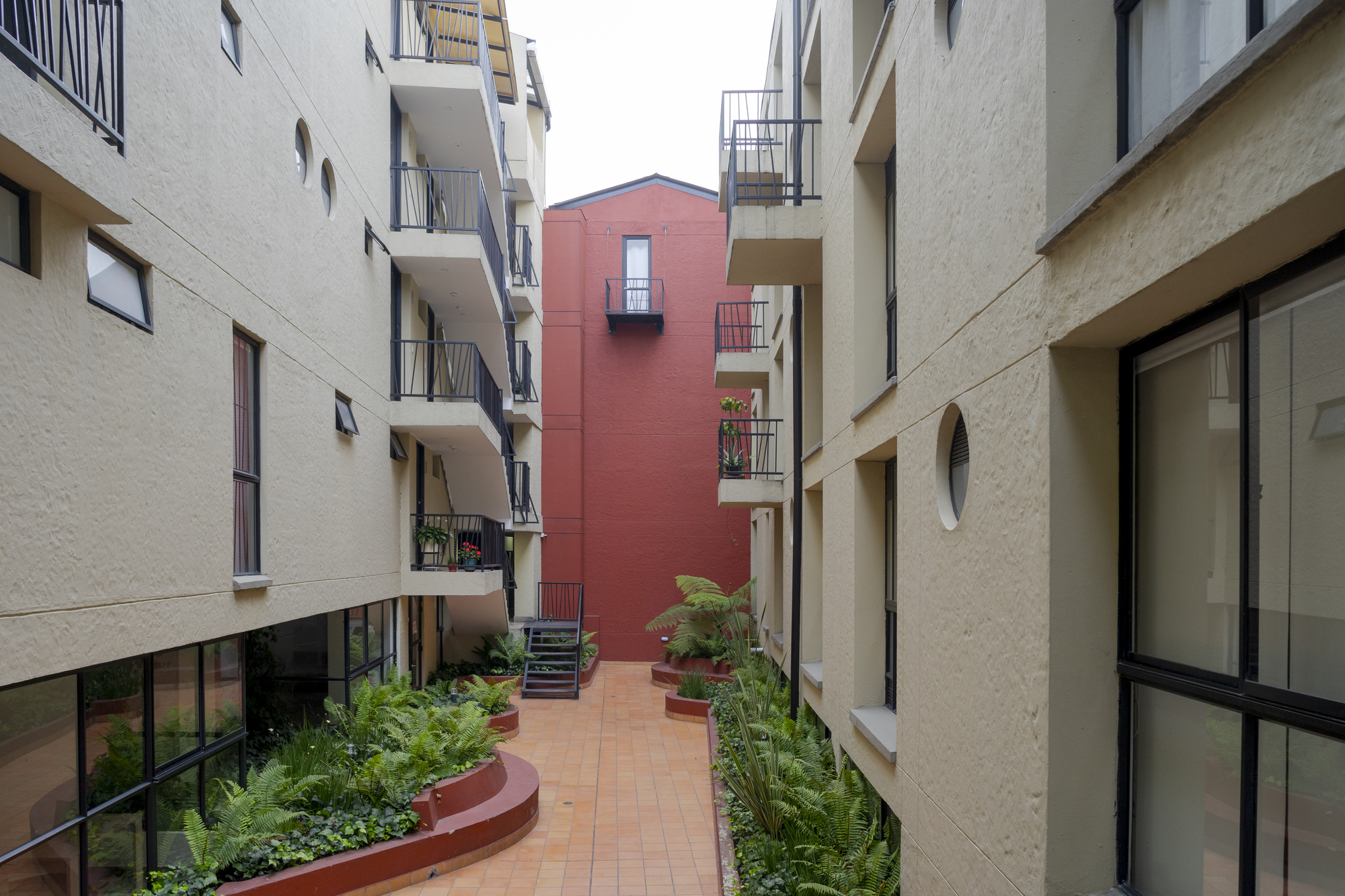 Gallery of Monfort Suites Royal Multi-family Housing Complex / Concreta ...