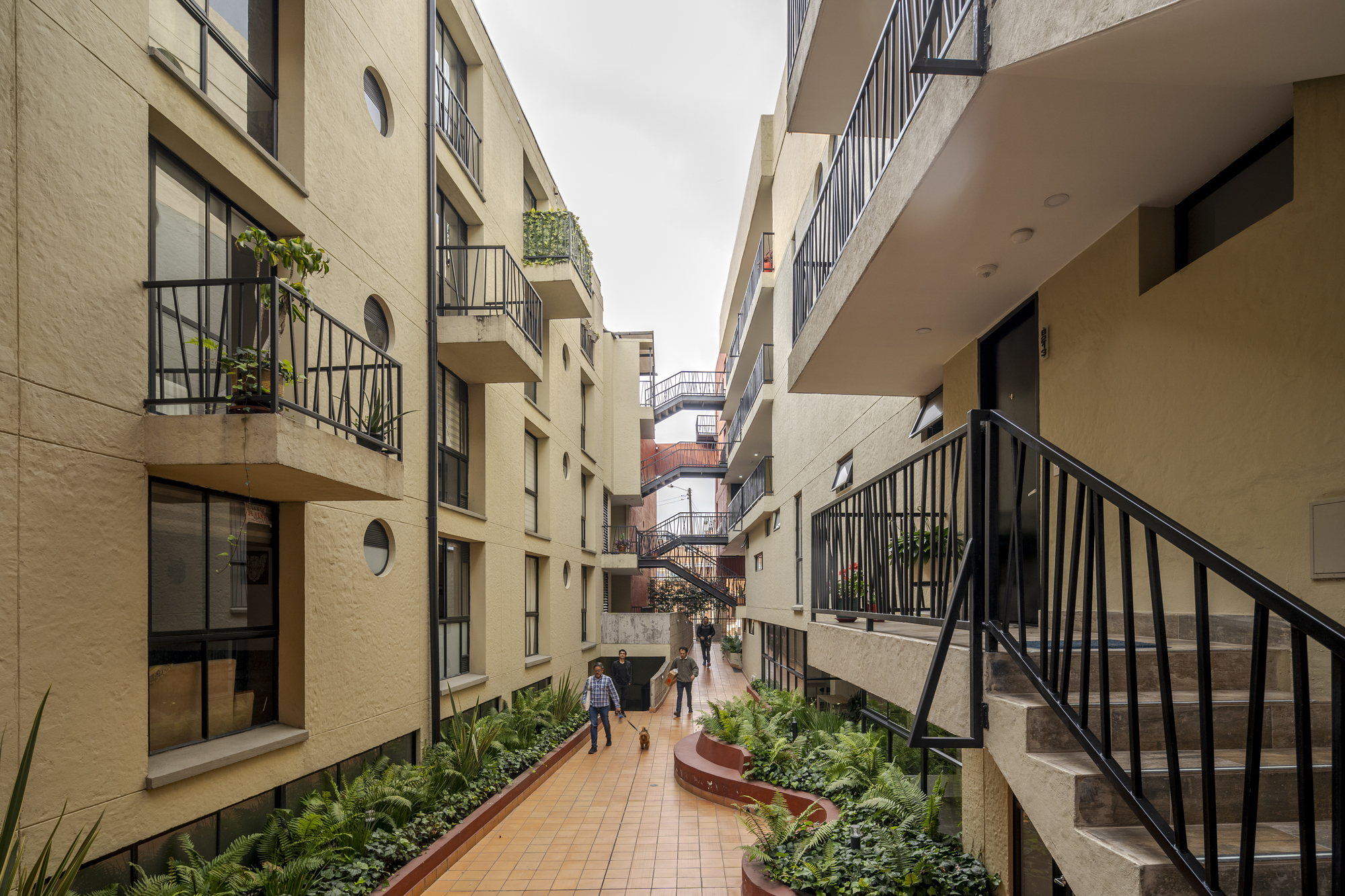 Gallery of Monfort Suites Royal Multi-family Housing Complex / Concreta ...