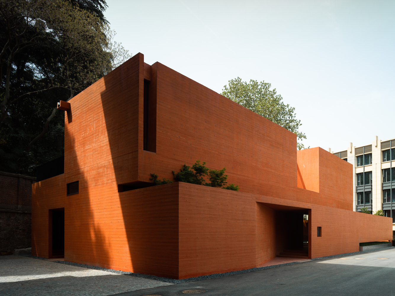 Gallery of More Than Gray: 15 Projects That Explore Red Pigmented ...